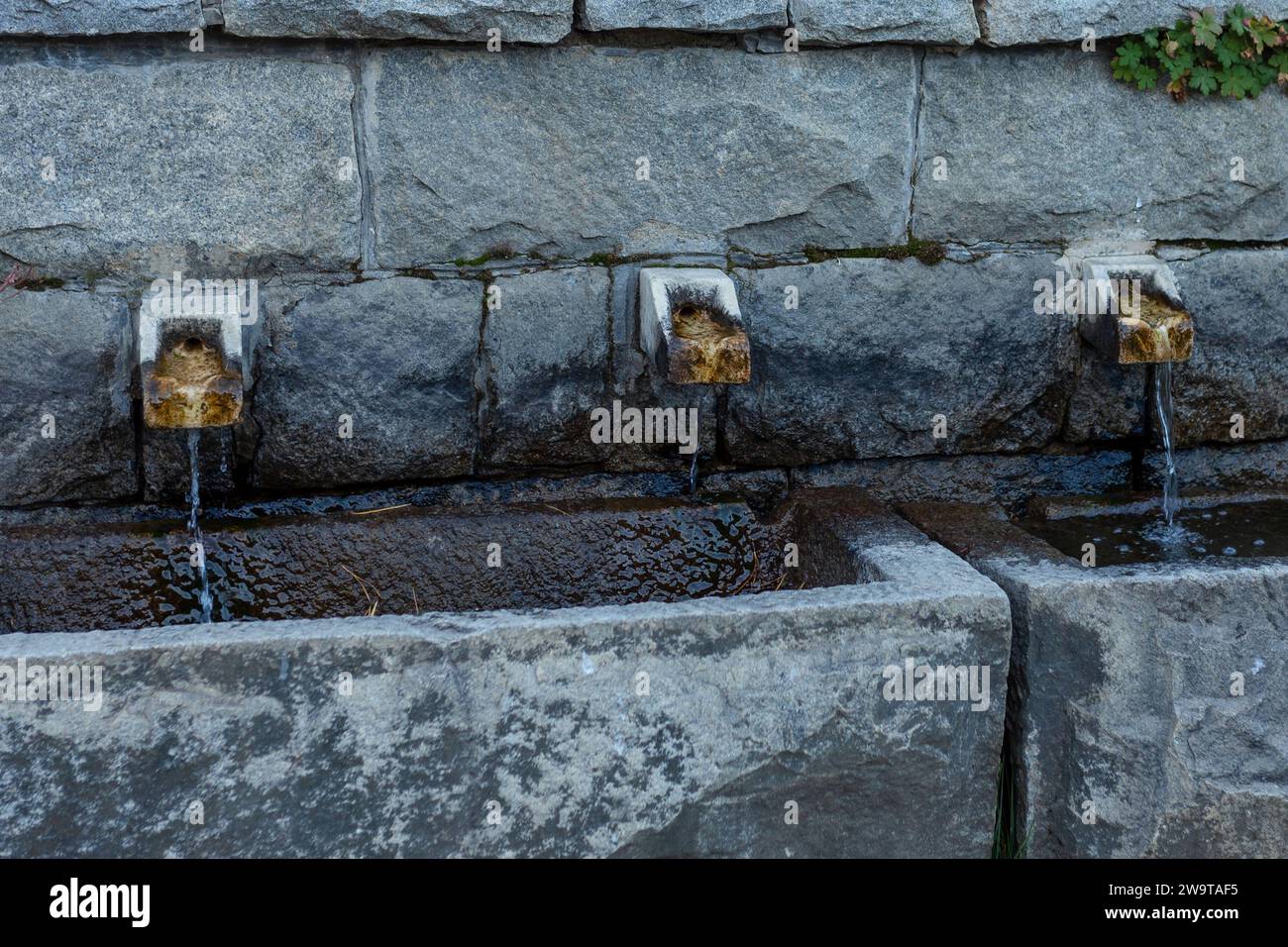 Natural source of fresh water coming out of the interior of a rock ...