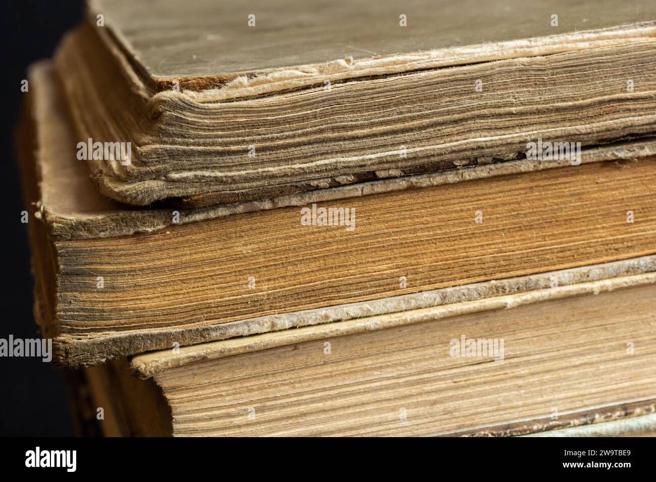 Book background. Stack of books in the library. Old yellow pages of ...