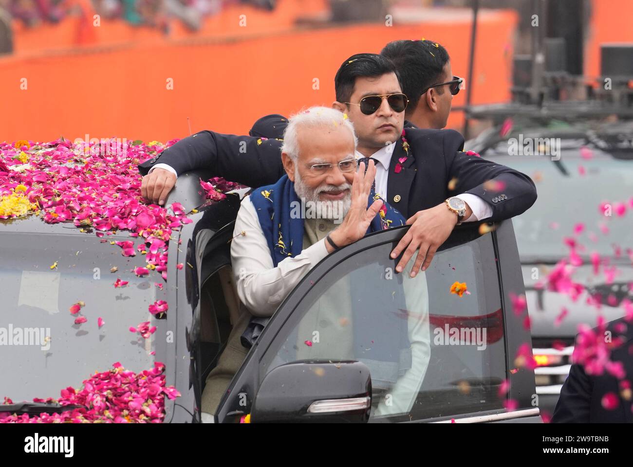 Indian Prime Minister Narendra Modi waves to the crowd during a road ...