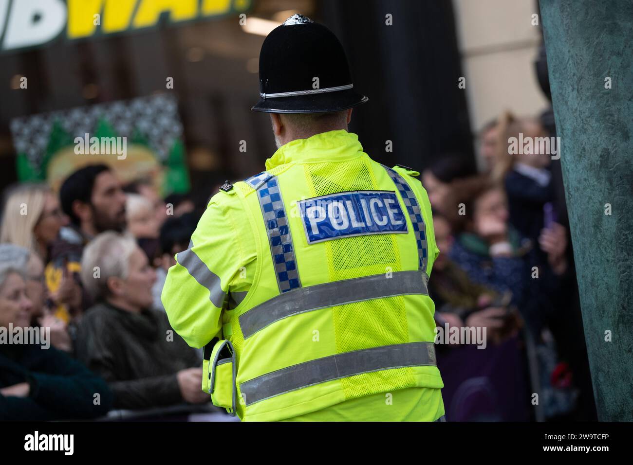 South Yorkshire Police Officer wearing a hi-visibily coat carrying out ...