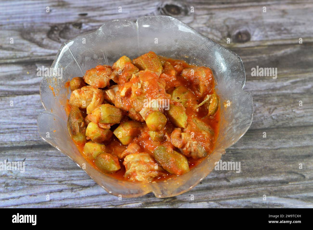 African lady cooking stew hi-res stock photography and images - Alamy