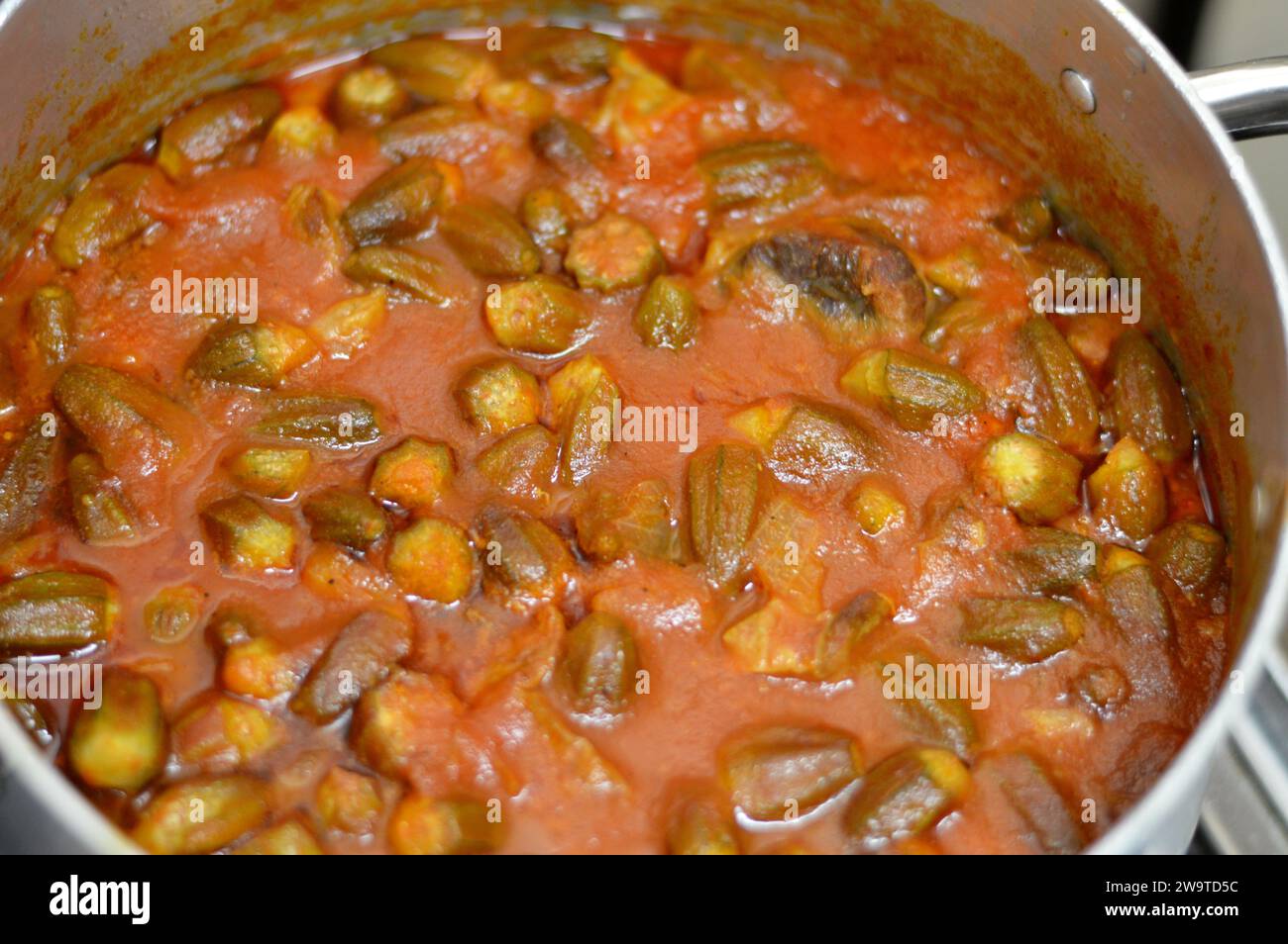 African lady cooking stew hi-res stock photography and images - Alamy