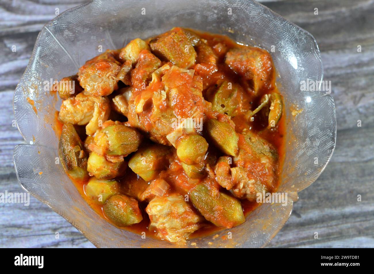 African lady cooking stew hi-res stock photography and images - Alamy