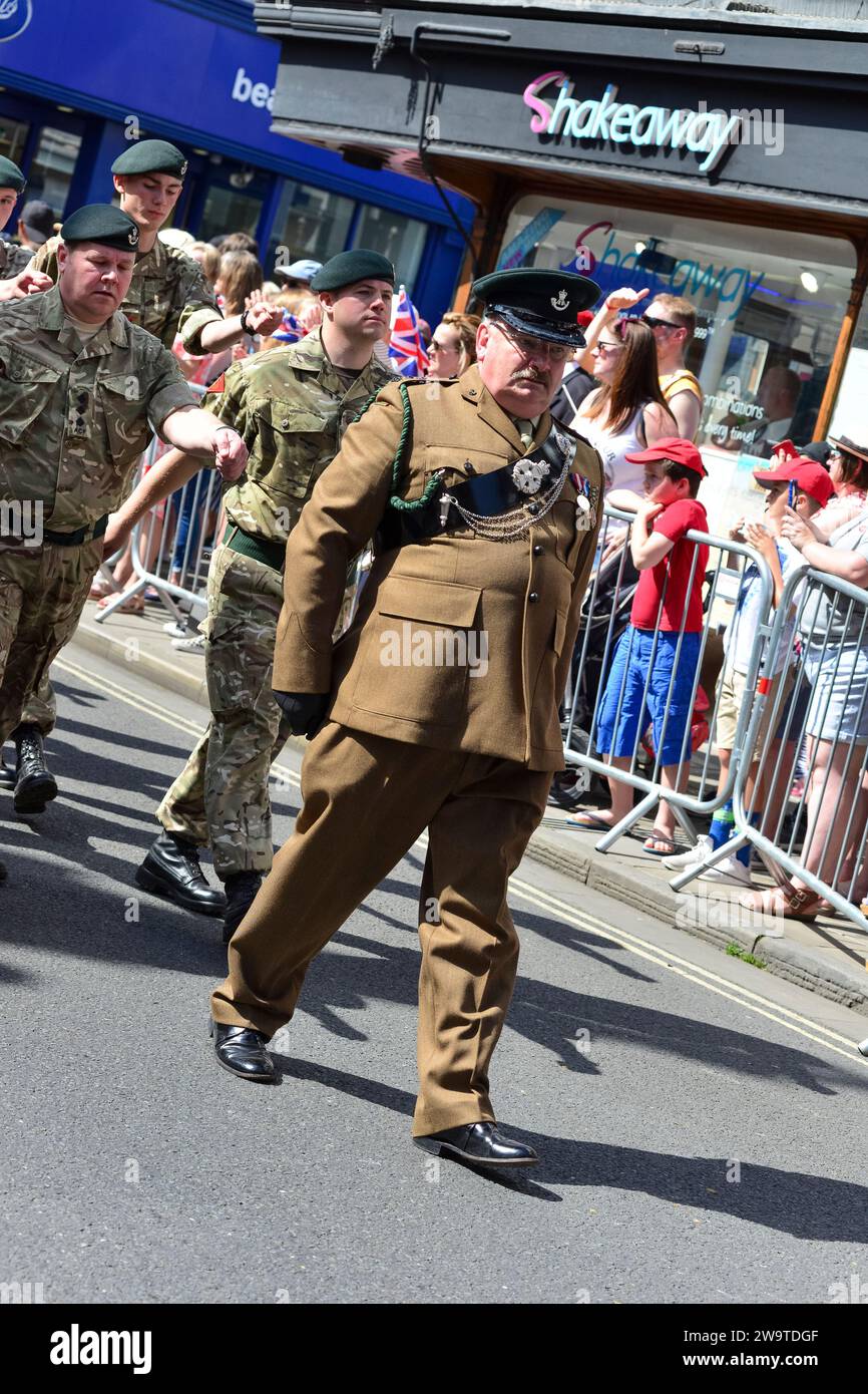 Soldiers, led by senior officer, marching at Armed Forces Day ...