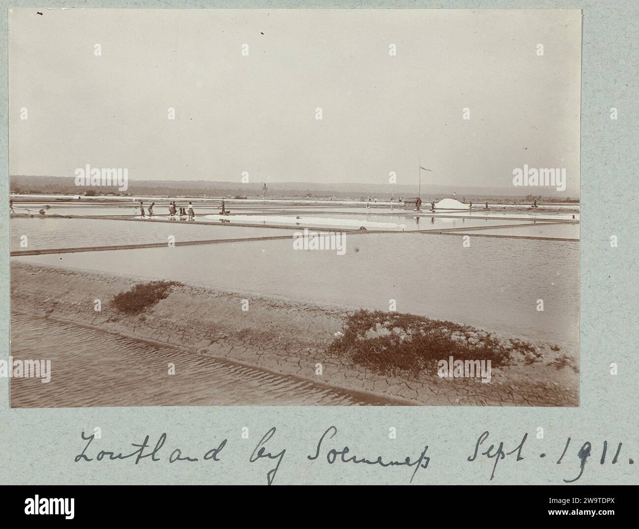 Filtering salt from seawater on an open ground in Sumenep located by ...