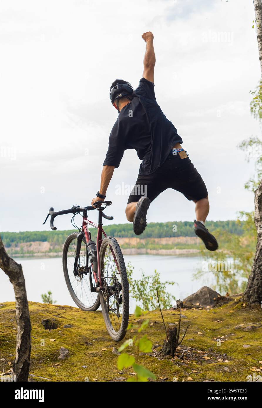 Happy cyclist celebrating victory in reaching the goal. Sports training ...