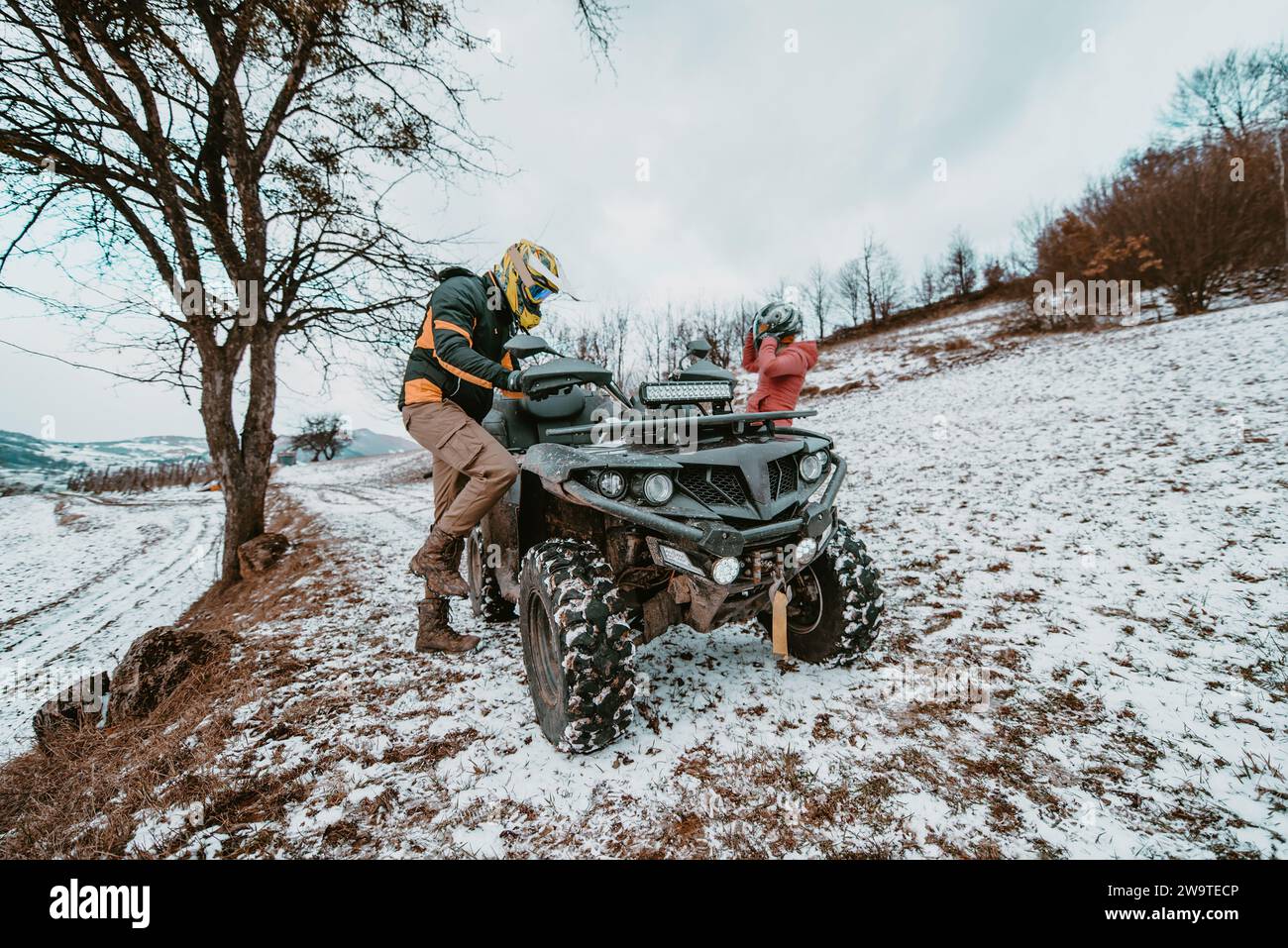 An adventurous couple prepares for an exhilarating quad ride through ...