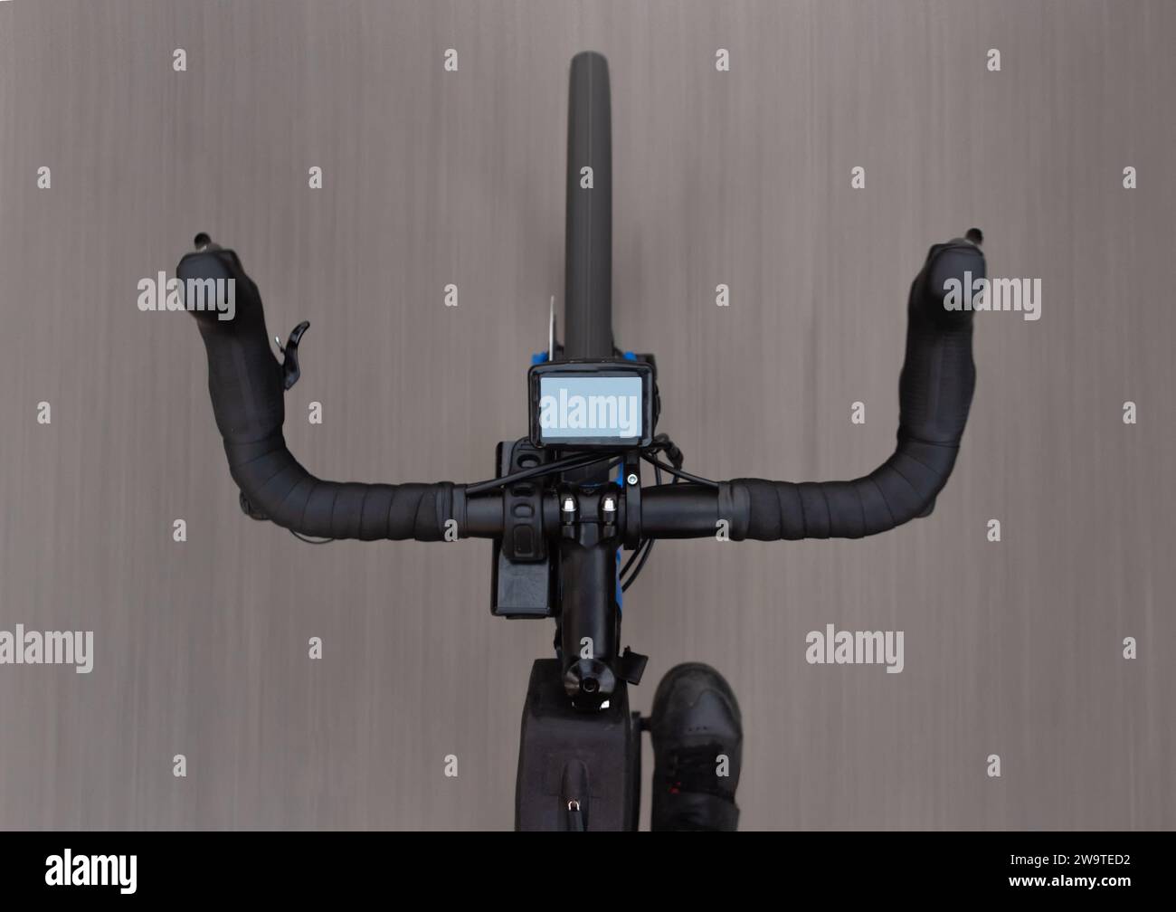 Top view of a gravel bicycle riding on the road. Blurred background for ...