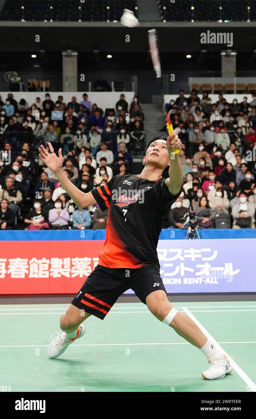 Kento Momota returns a shuttlecock against Koki Watanabe during the All Japan Badminton ...