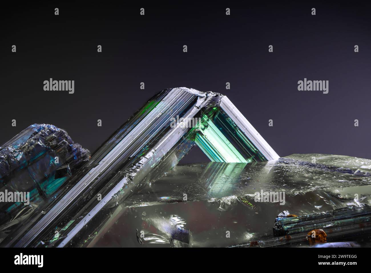 elbaite (green tourmaline) detail texture background. close-up raw ...