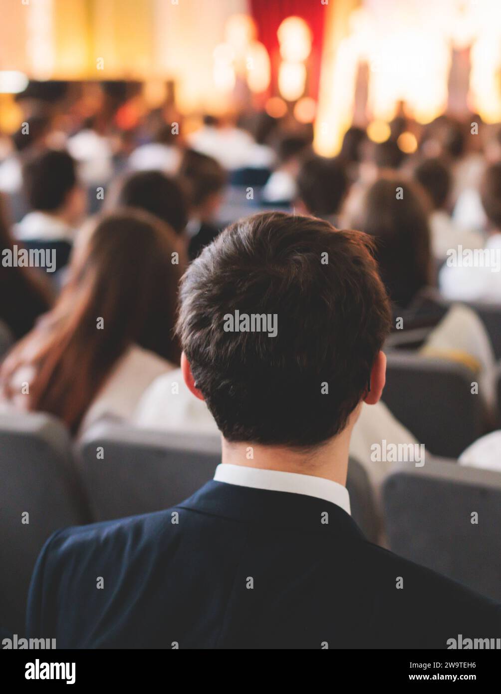 Boy in school hall auditorium hi-res stock photography and images - Alamy