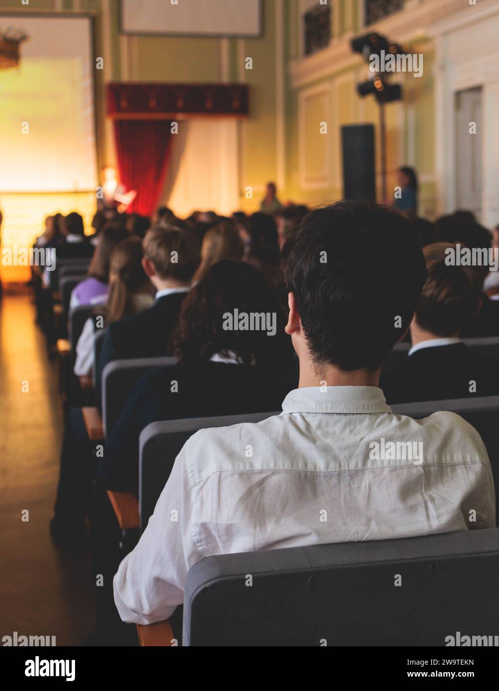 Boy in school hall auditorium hi-res stock photography and images - Alamy