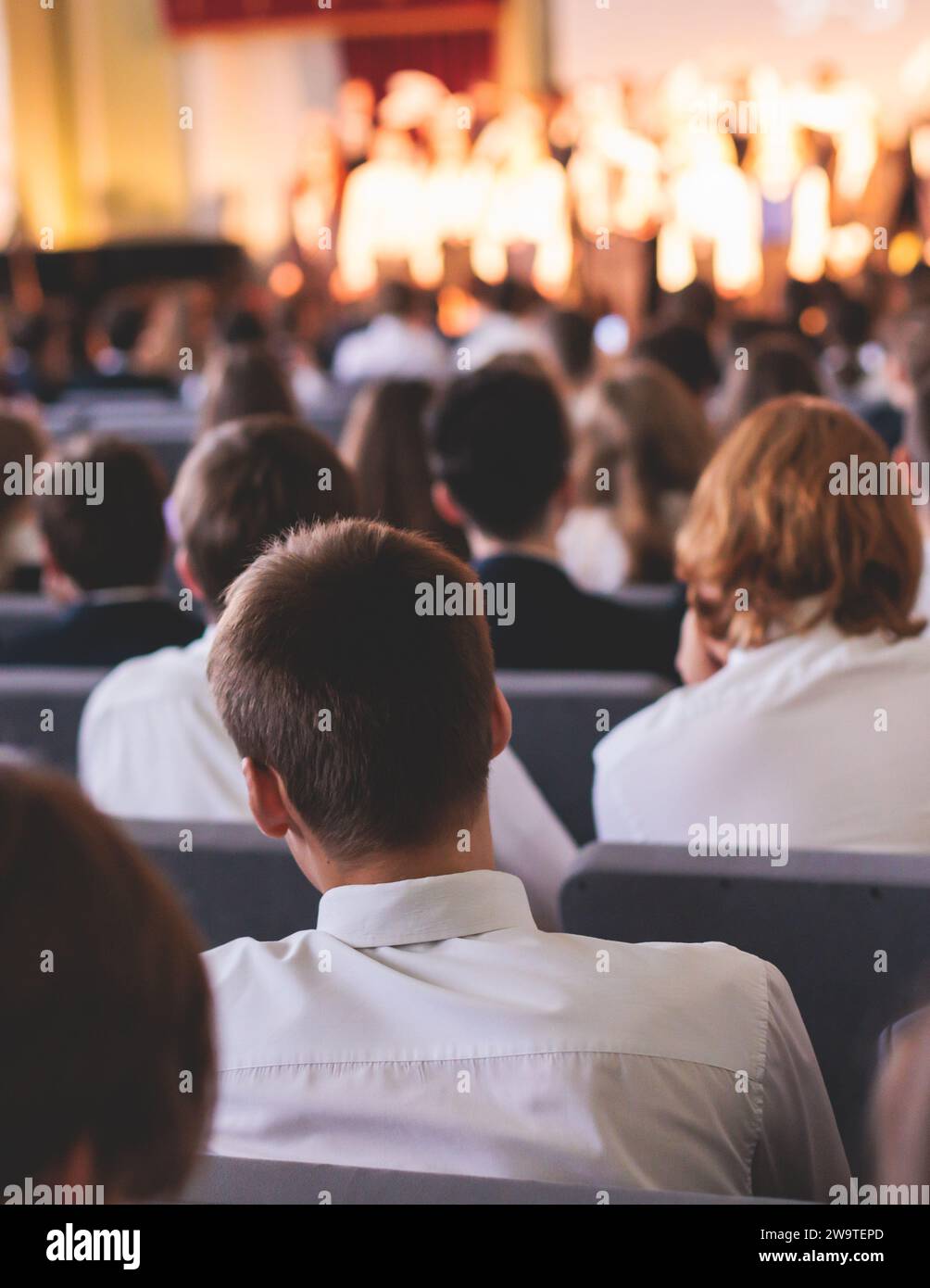 Boy in school hall auditorium hi-res stock photography and images - Alamy