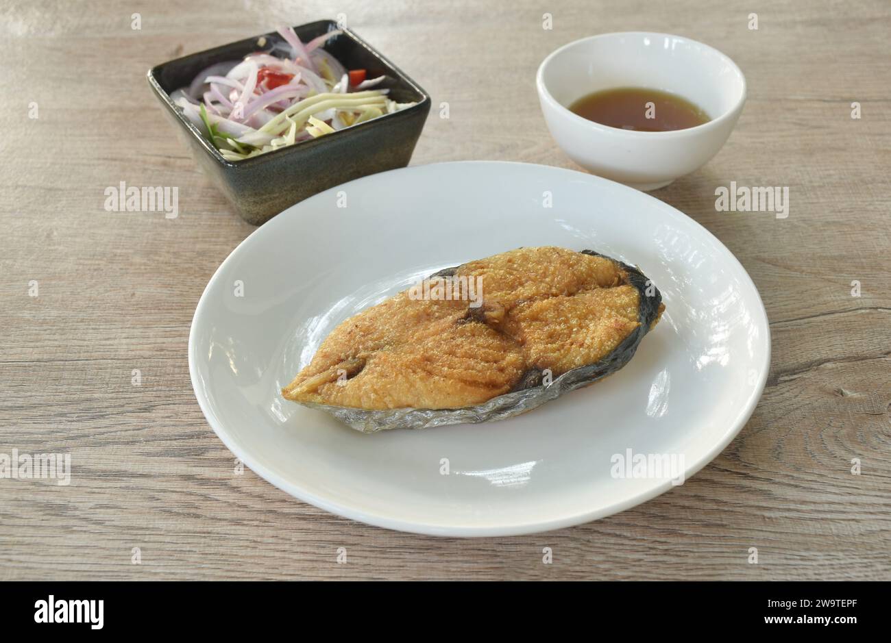 deep fried Indo-Pacific king mackerel fish dressing slice mango with ...