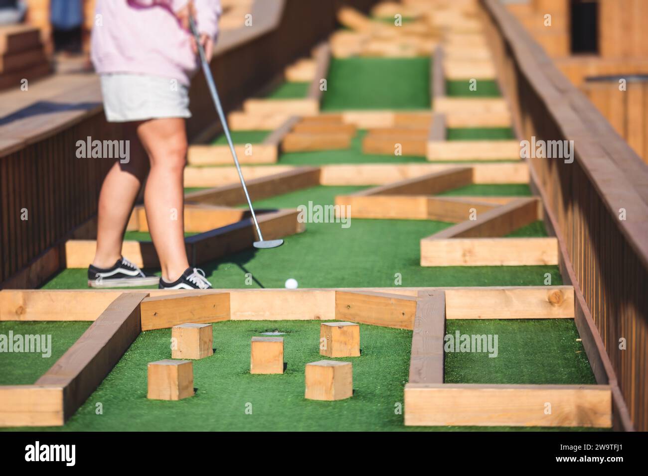 Mini golf course, process of playing miniature golf on a green ...