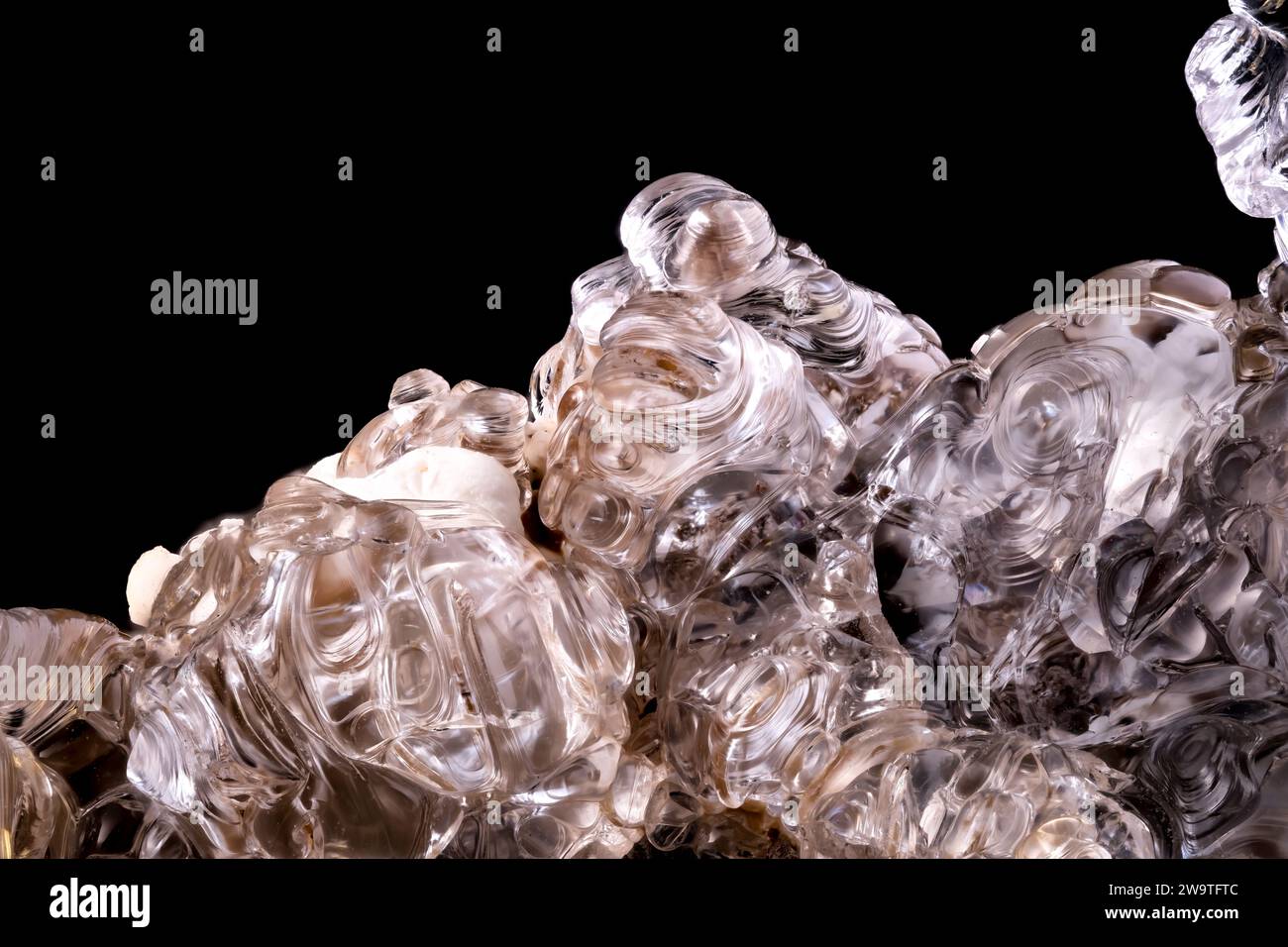 Hyalite opal crystal isolated on black background. macro detail close ...