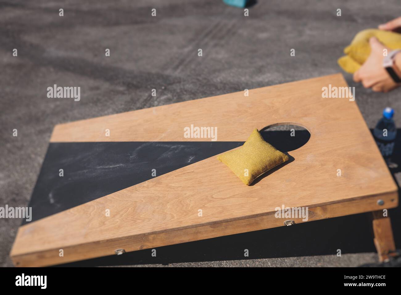 Cornhole game set, process of throwing bean bags, kids children tossing ...