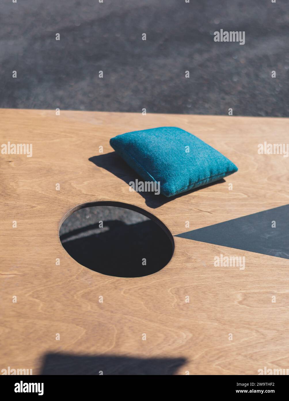 Cornhole game set, process of throwing bean bags, kids children tossing ...