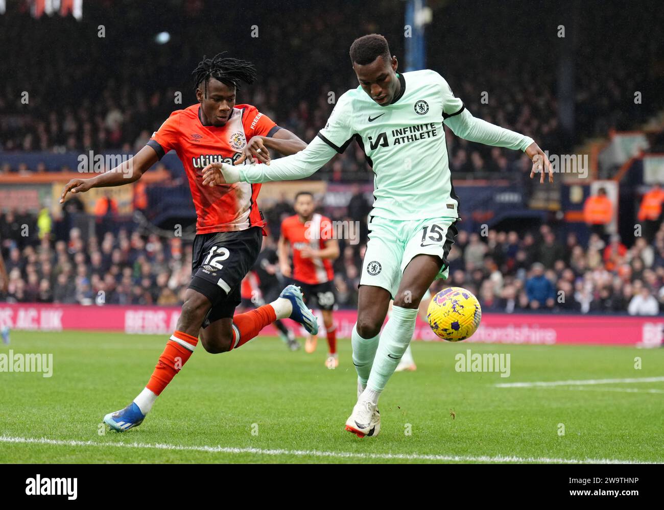 Luton Town's Issa Kabore (left) and Chelsea's Nicolas Jackson battle ...