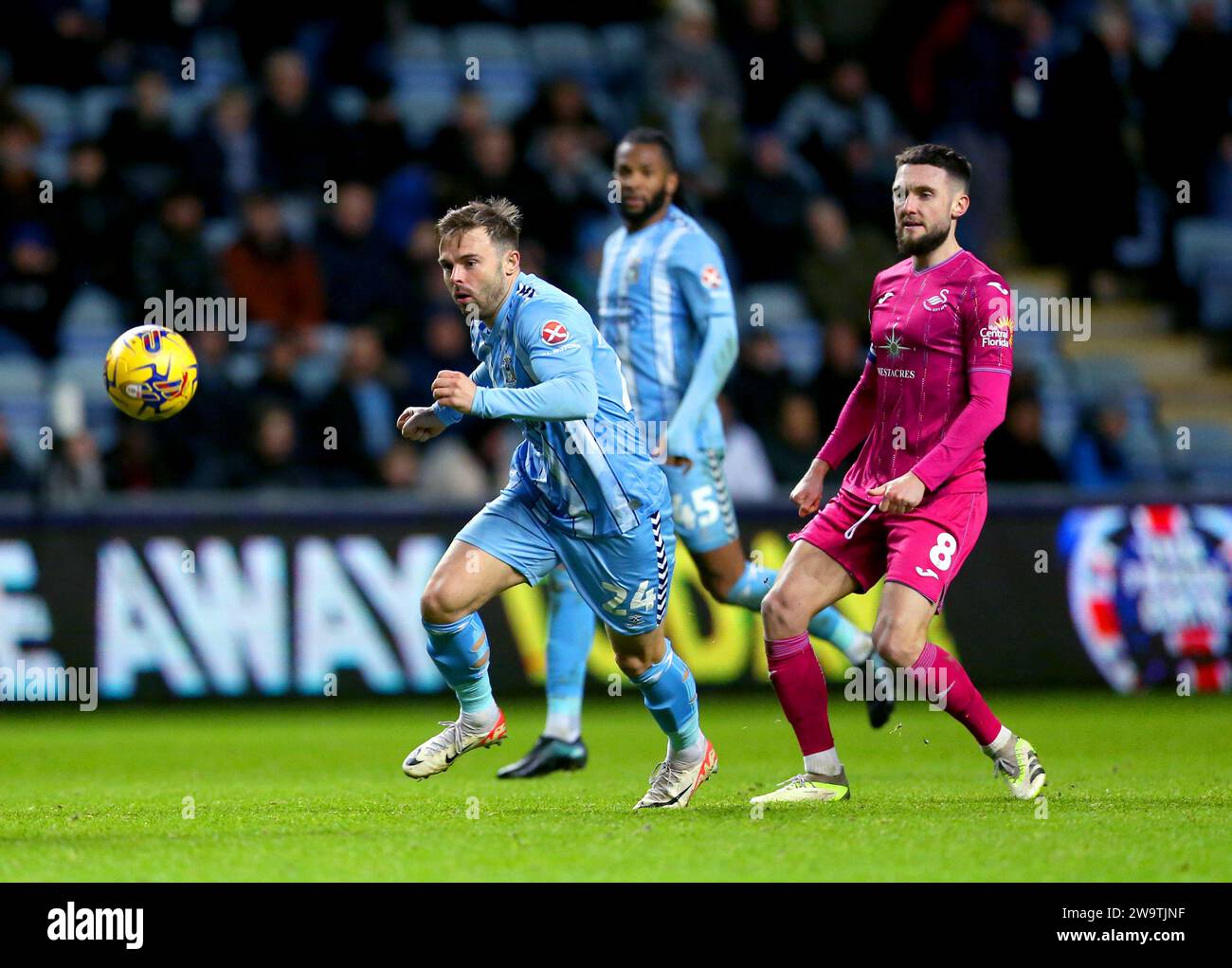 Coventry City's Matthew Godden (left) and Swansea City's Matt Grimes ...