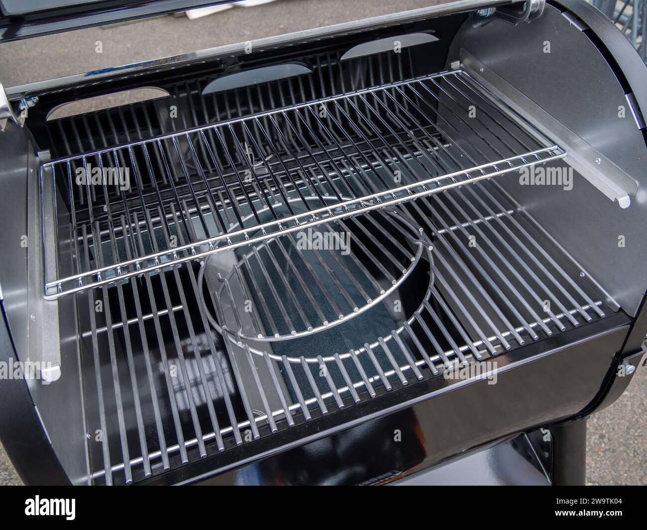 Fragment of a metal brazier with a grill grate Stock Photo - Alamy