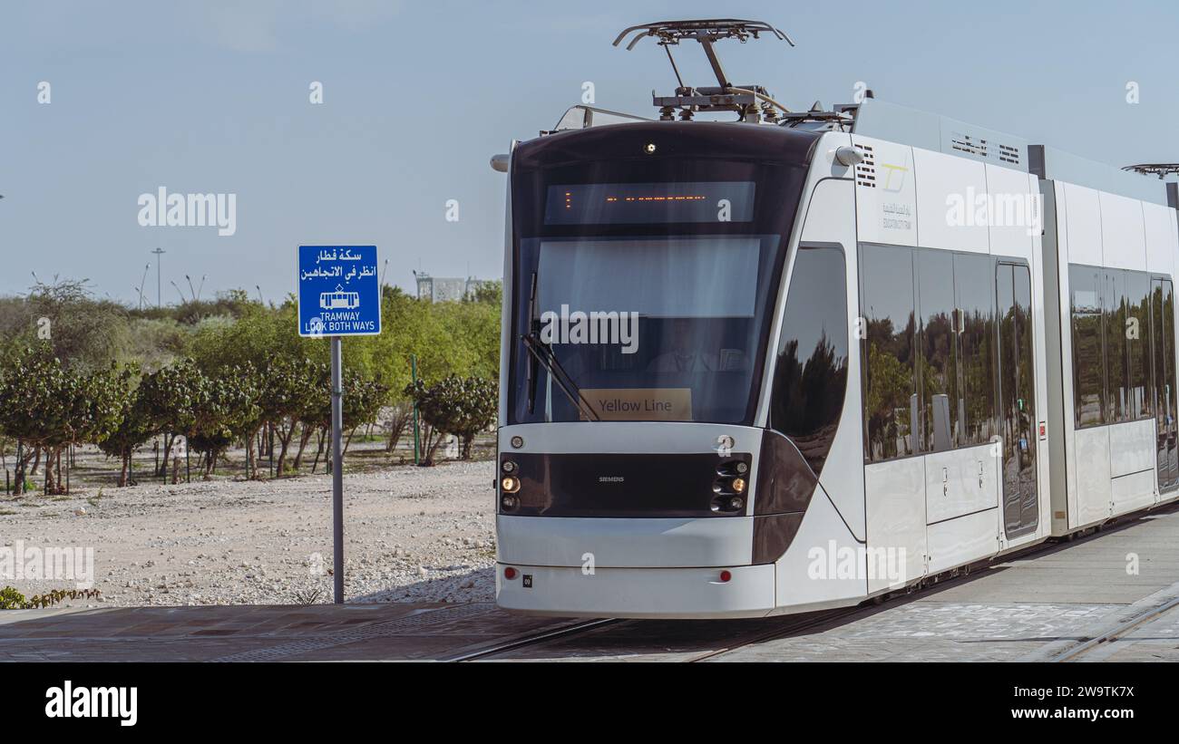 Doha, Qatar- December 12,2023 : yellow line Tram at education city ...