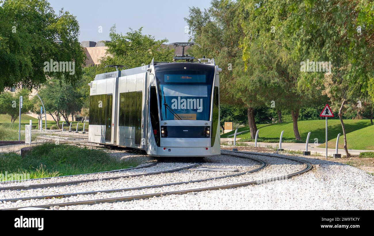 Doha, Qatar- December 12,2023 : yellow line Tram at education city ...