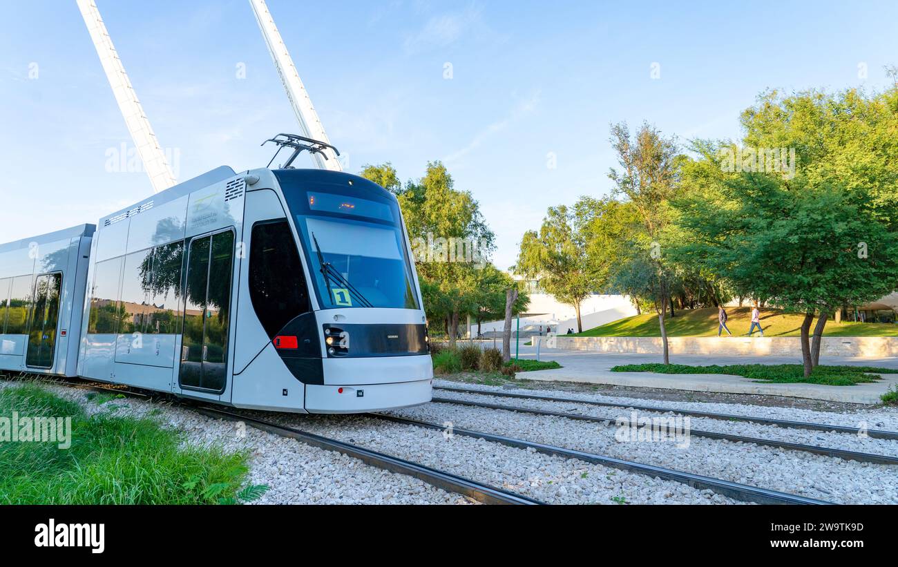 Doha, Qatar- December 12,2023 : yellow line Tram at education city ...