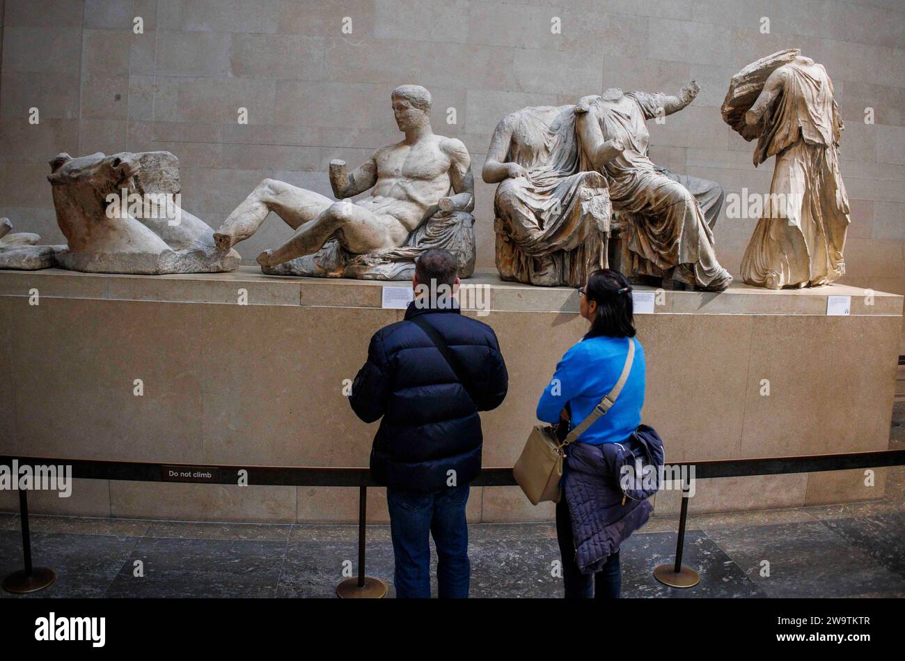 London, UK. 30th Dec, 2023. Visitors at the British Museum view ancient sculptures in the ...