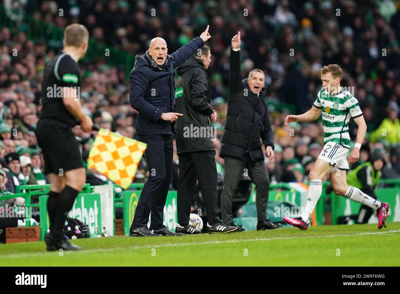 Rangers manager Philippe Clement (centre) and Celtic manager Brendan Rodgers gesture on the ...