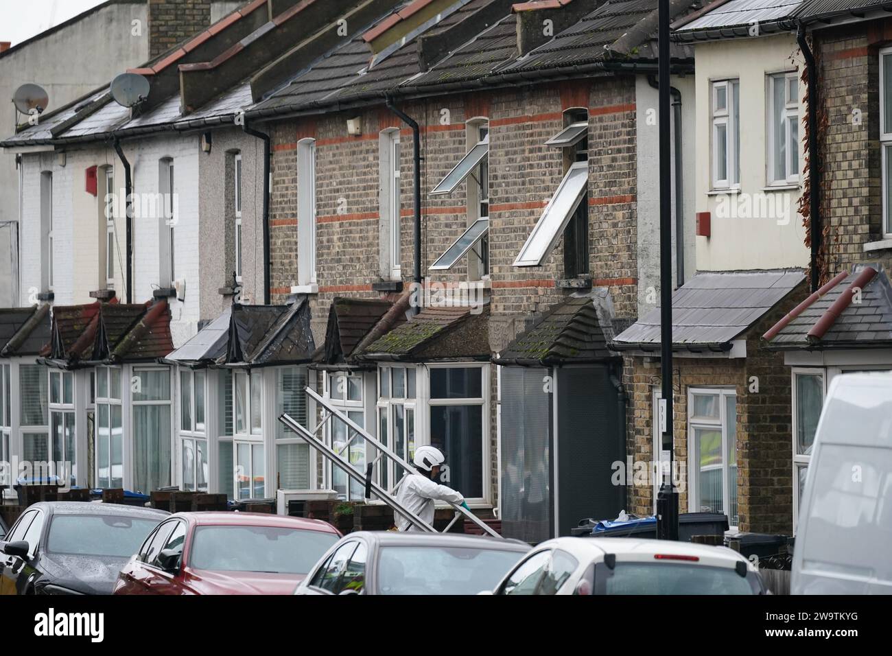 Fire investigators enter a property on Sanderstead Road, Croydon, south ...