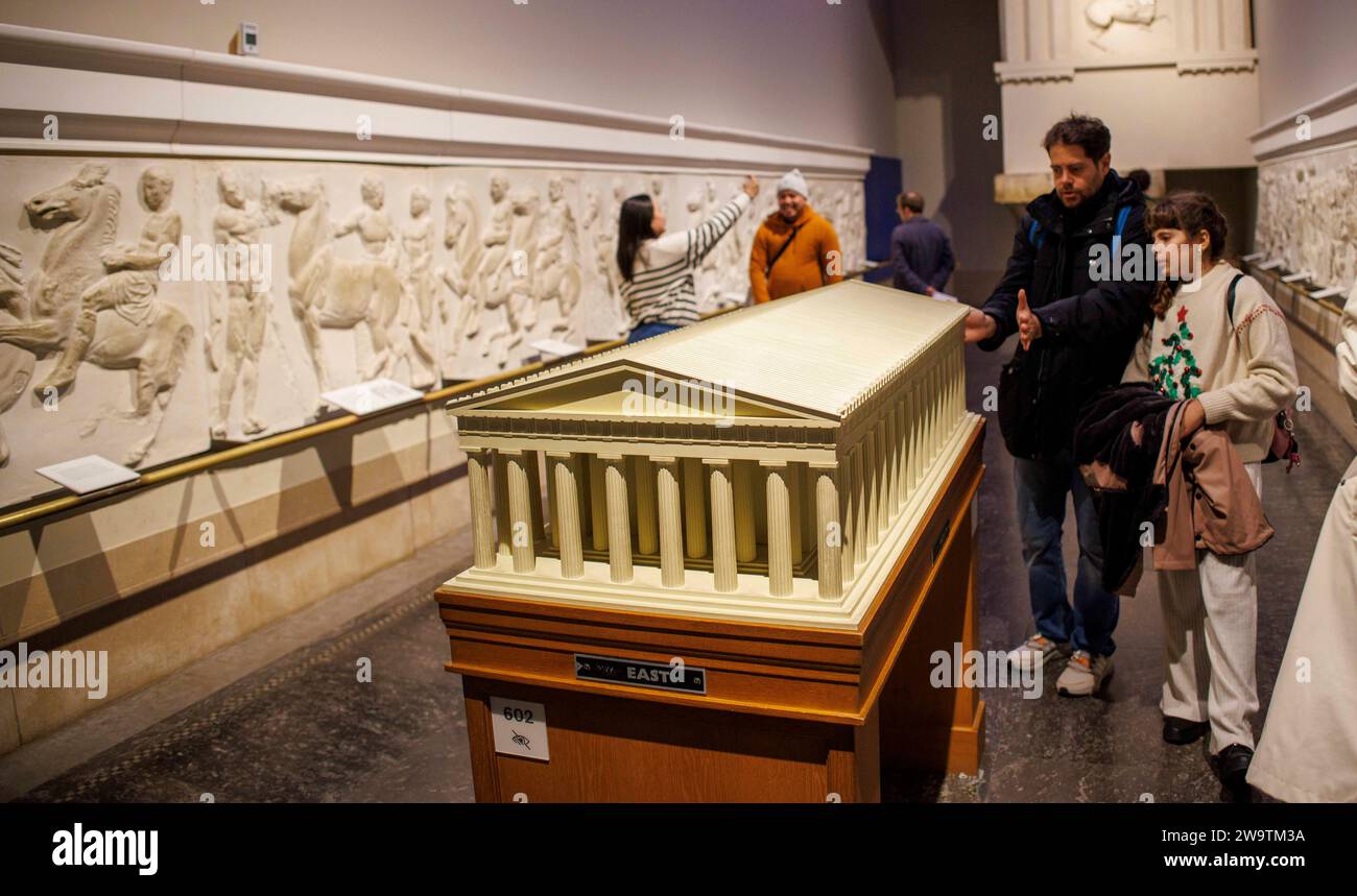 London, UK. 30th Dec, 2023. A Model of The Acropolis. Visitors at the British Museum view ...