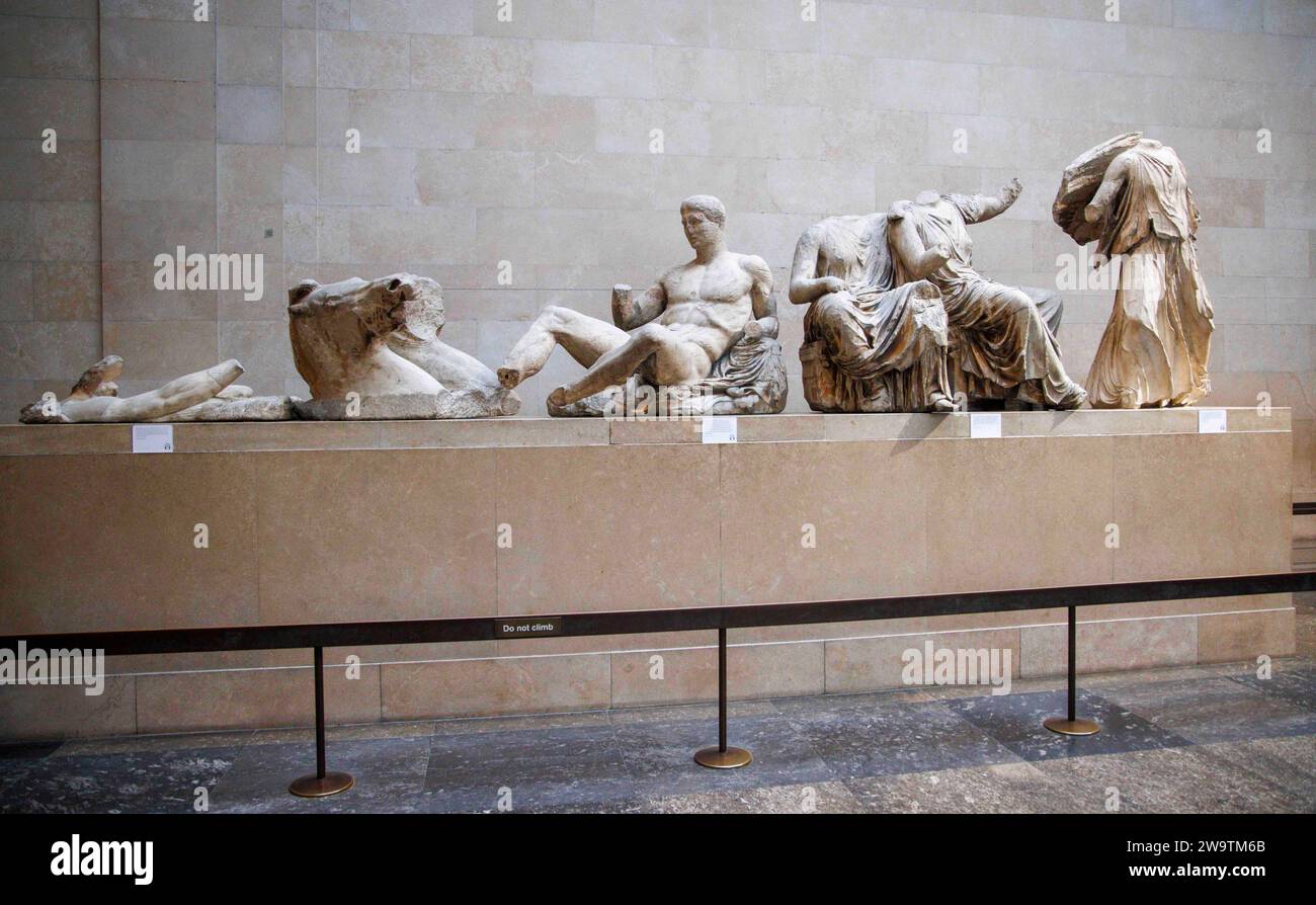 London, UK. 30th Dec, 2023. Visitors at the British Museum view ancient sculptures in the ...