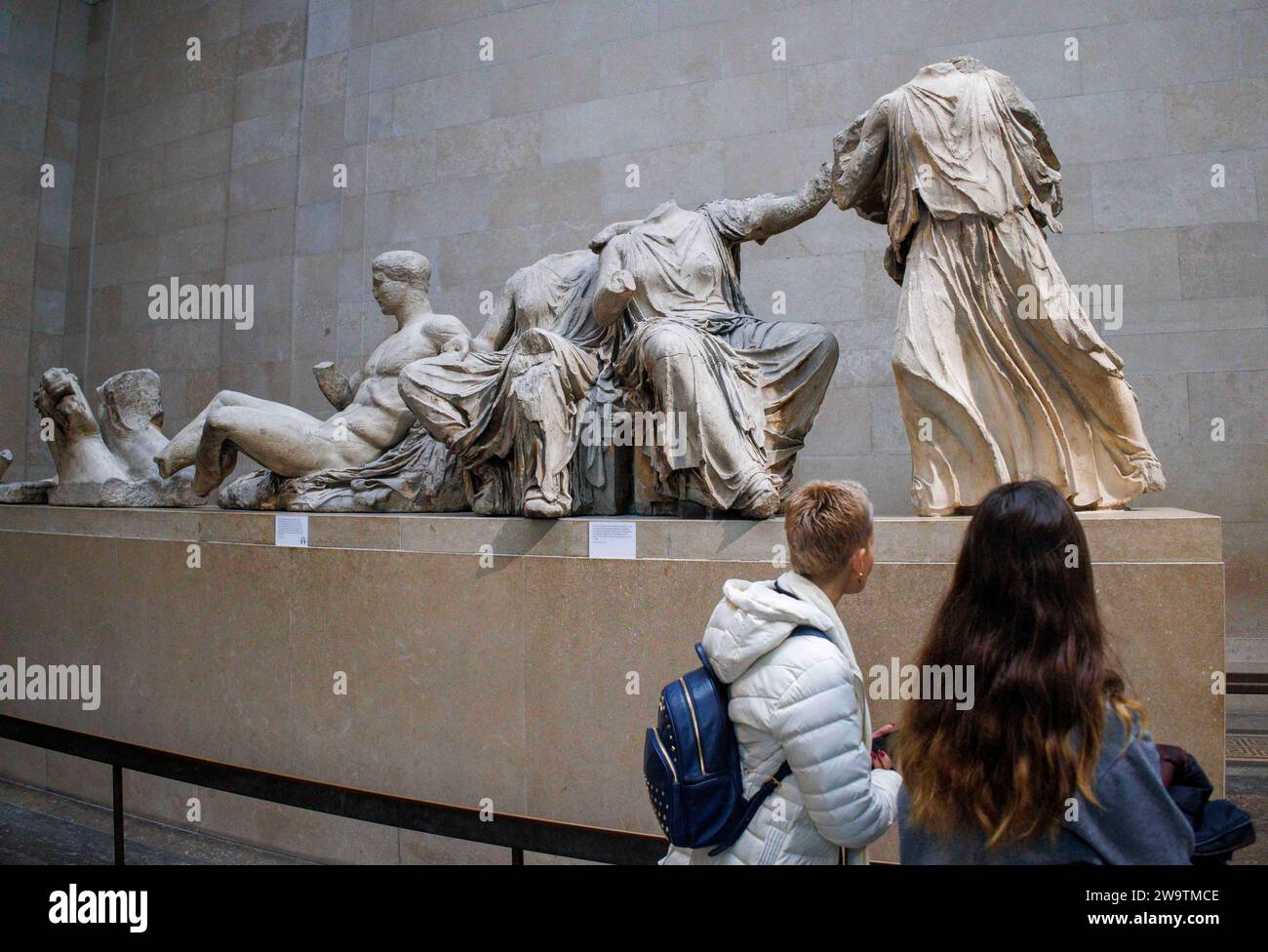 London, UK. 30th Dec, 2023. Visitors at the British Museum view ancient sculptures in the ...