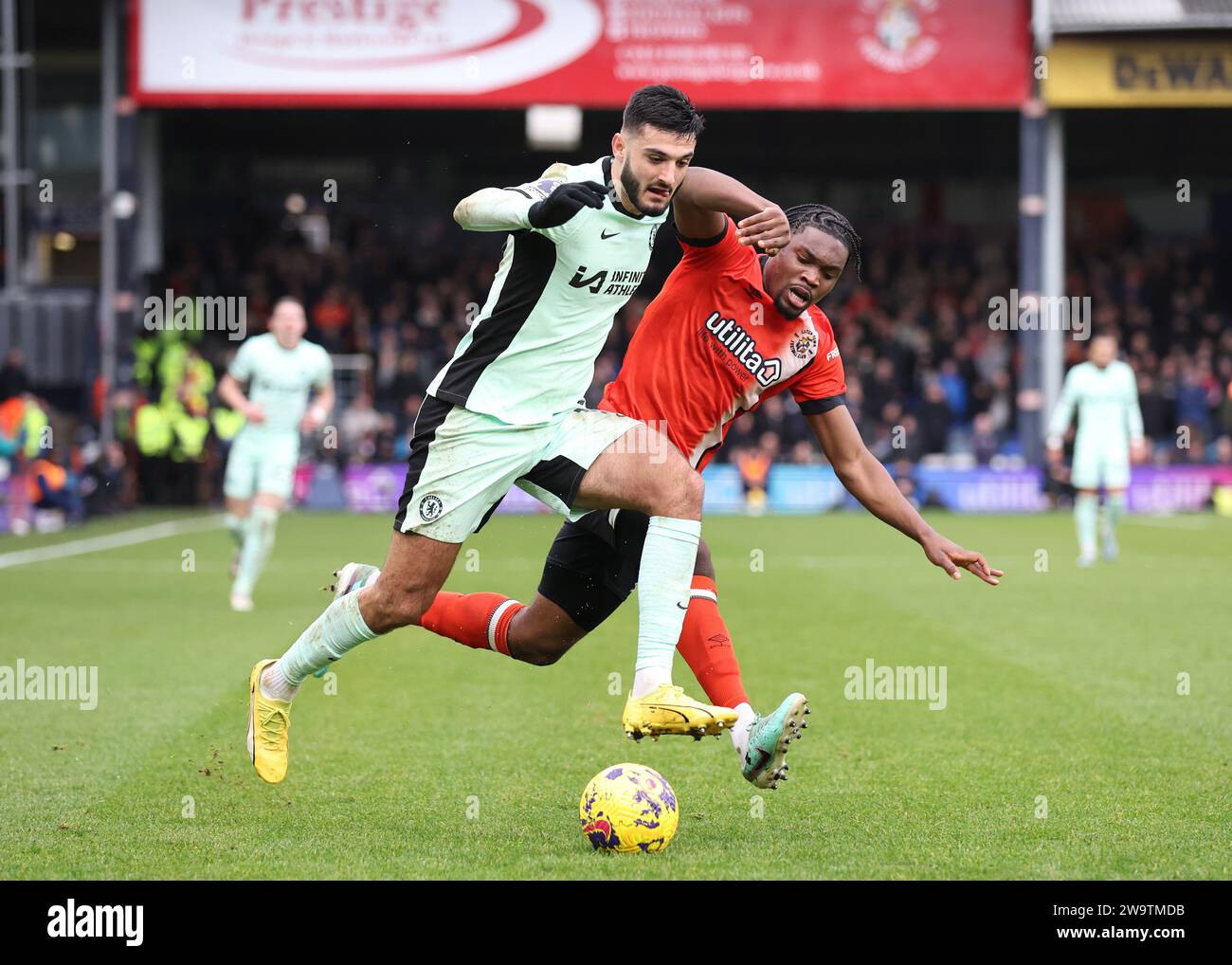 Luton, UK. 30th Dec, 2023. Teden Mengi of Luton Town challenges Armando ...