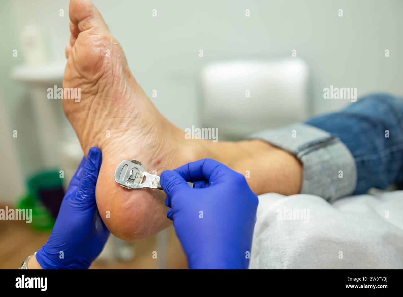 concept of male pedicure, foot pedicure, cosmetologist makes classic ...