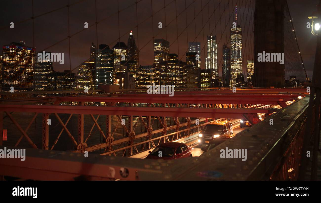 New York skyline during rush hour over the Brooklyn Bridge at night ...