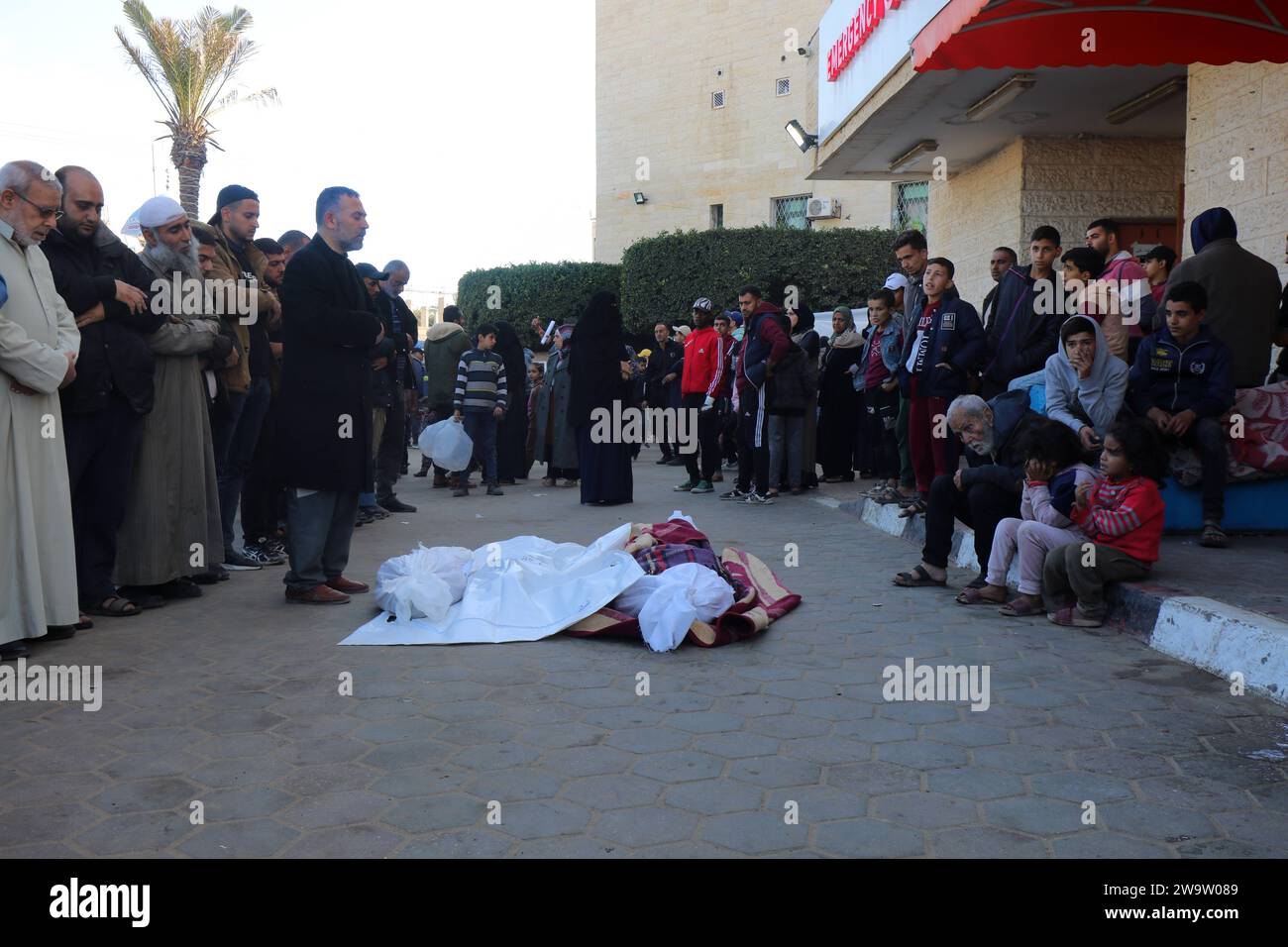 Relatives of the Palestinians died in Israeli attacks, mourn as they ...