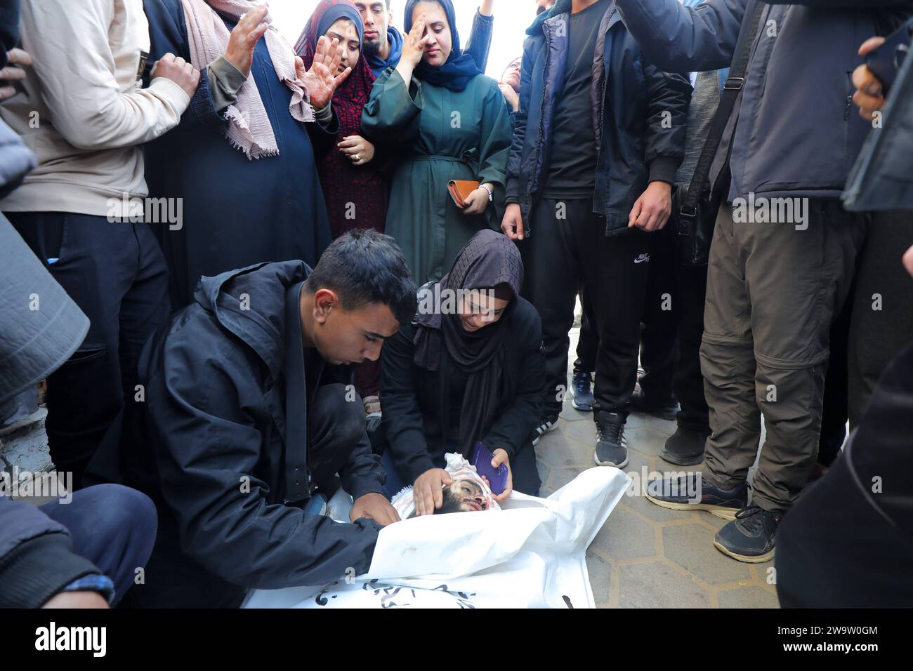 Relatives of the Palestinians died in Israeli attacks, mourn as they ...
