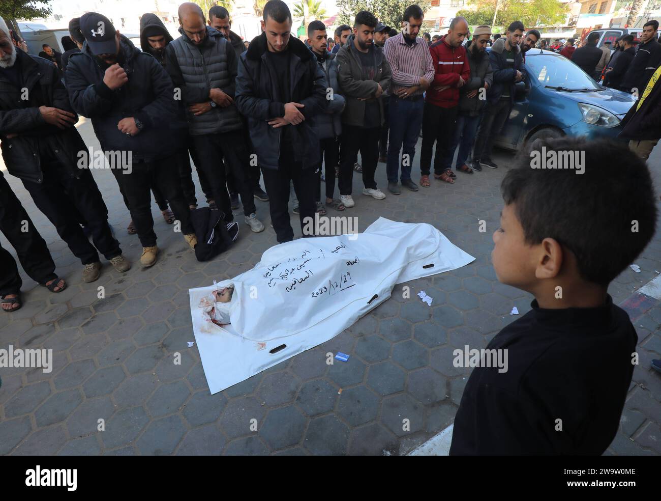 Relatives of the Palestinians died in Israeli attacks, mourn as they ...