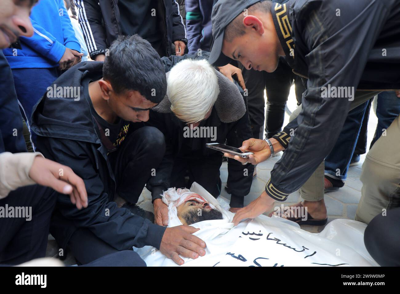 Relatives of the Palestinians died in Israeli attacks, mourn as they ...