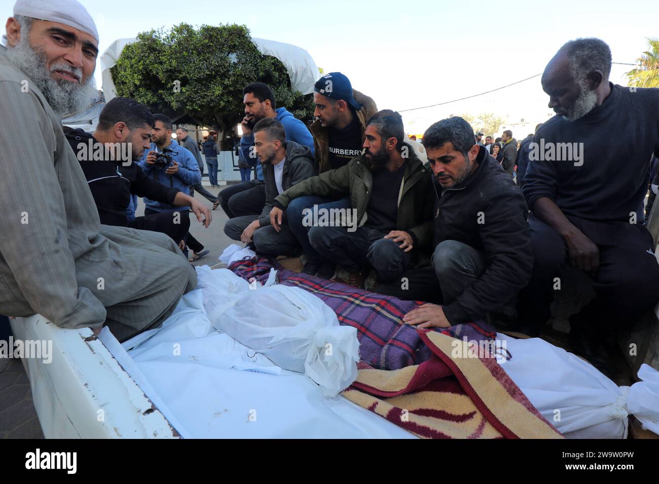 Relatives of the Palestinians died in Israeli attacks, mourn as they ...