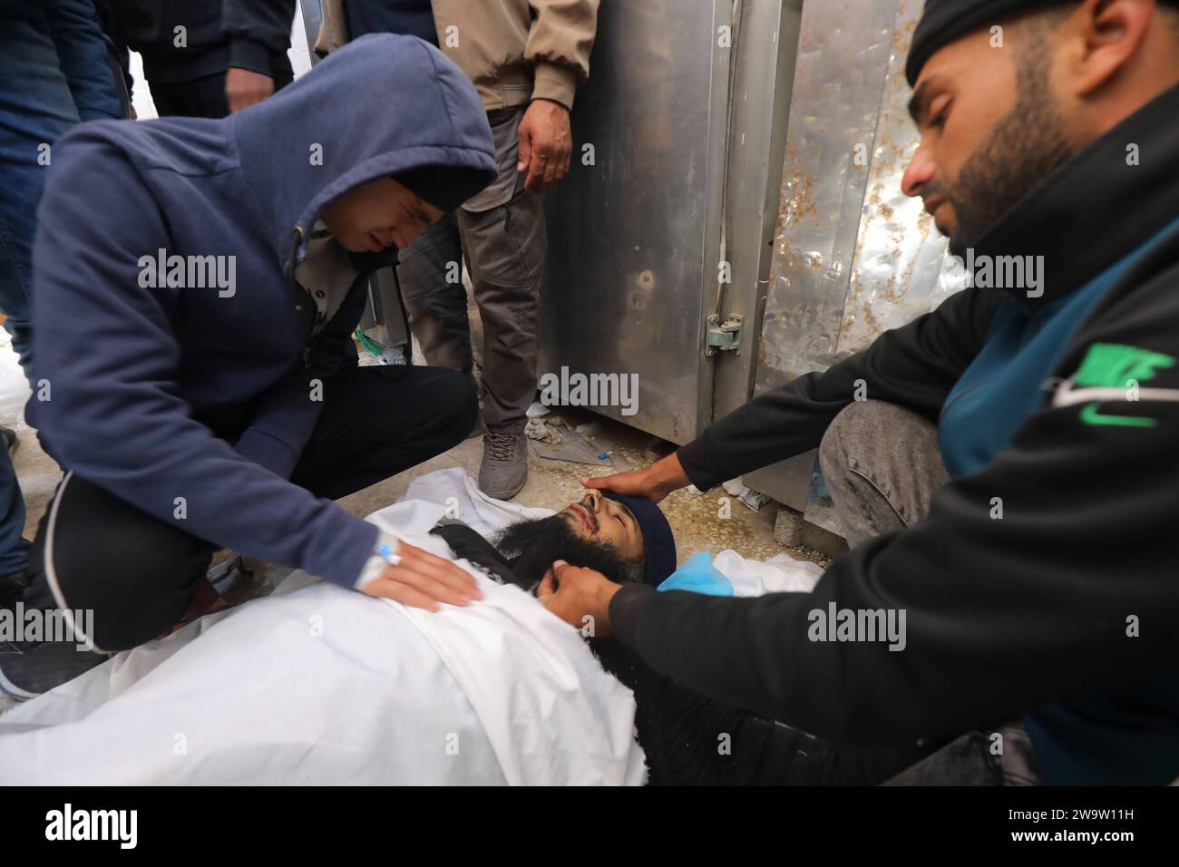 Relatives of the Palestinians died in Israeli attacks, mourn as they ...