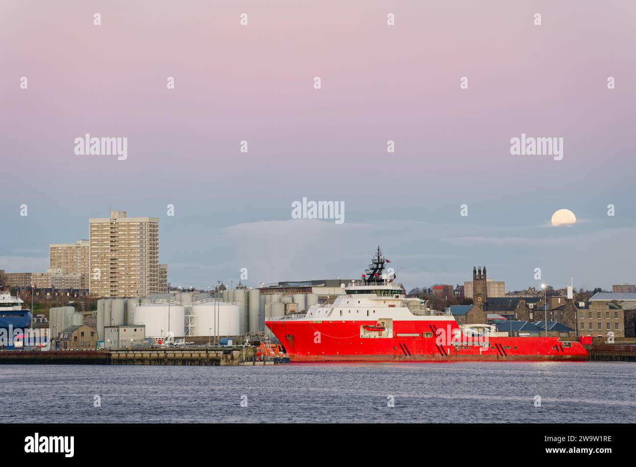 Aberdeen harbour and ship viewed during sunrise Stock Photo - Alamy