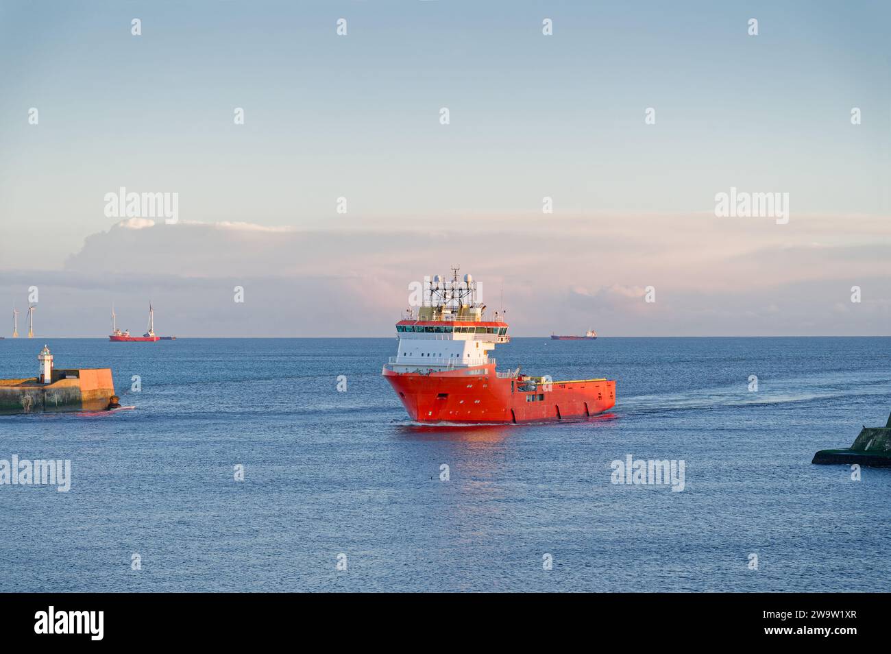 Ship arriving at Aberdeen harbour after passing Girdle Ness Lighthouse ...
