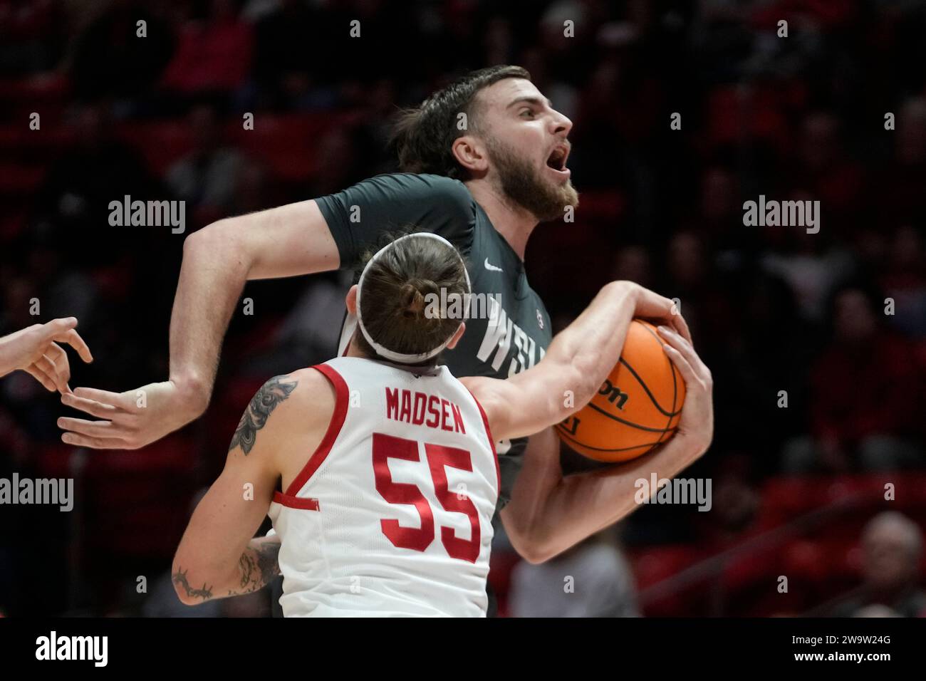 Utah guard Gabe Madsen (55) defends against Washington State forward ...