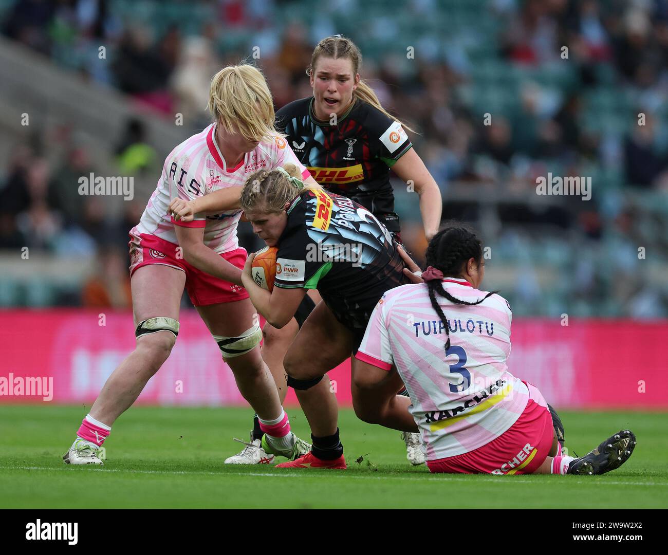 Harlequins' Connie Powell is tackled by Gloucetser’s Sisilia Tuipulotu ...