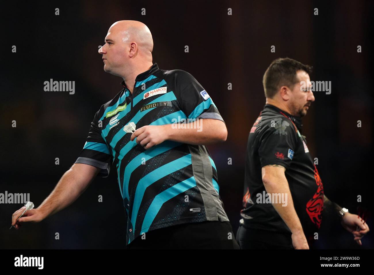 Rob Cross in action against Jonny Clayton (not pictured) on day ...