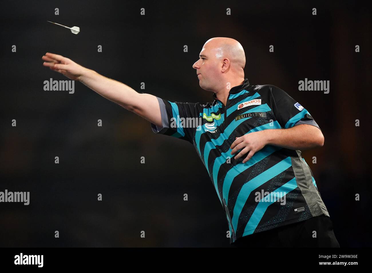 Rob Cross in action against Jonny Clayton (not pictured) on day ...