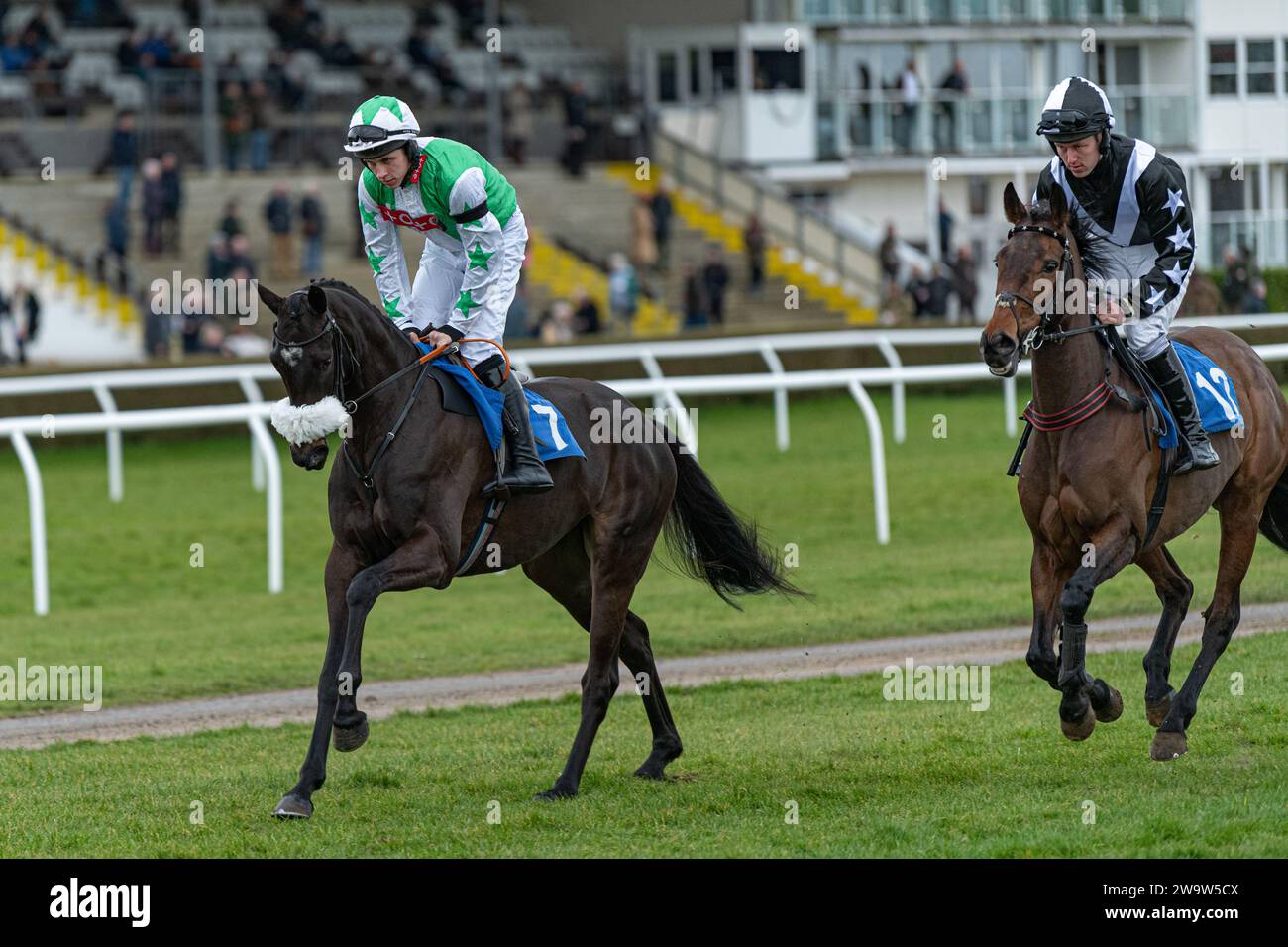 Riders and horses canter to the strt hi-res stock photography and ...